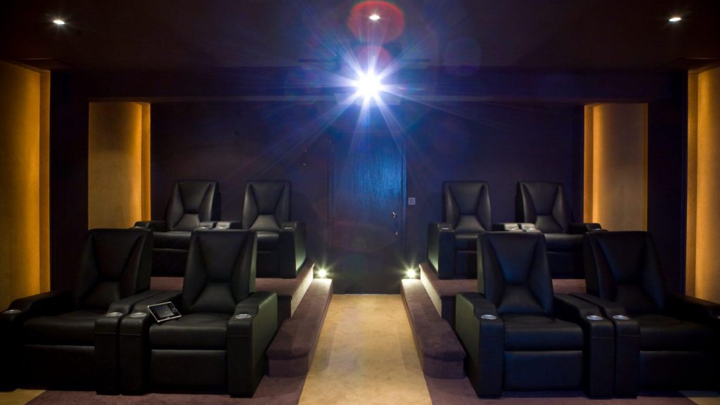 Double-garage-cinema-room-seating-and-ceiling-mounted-Runco-projector ...